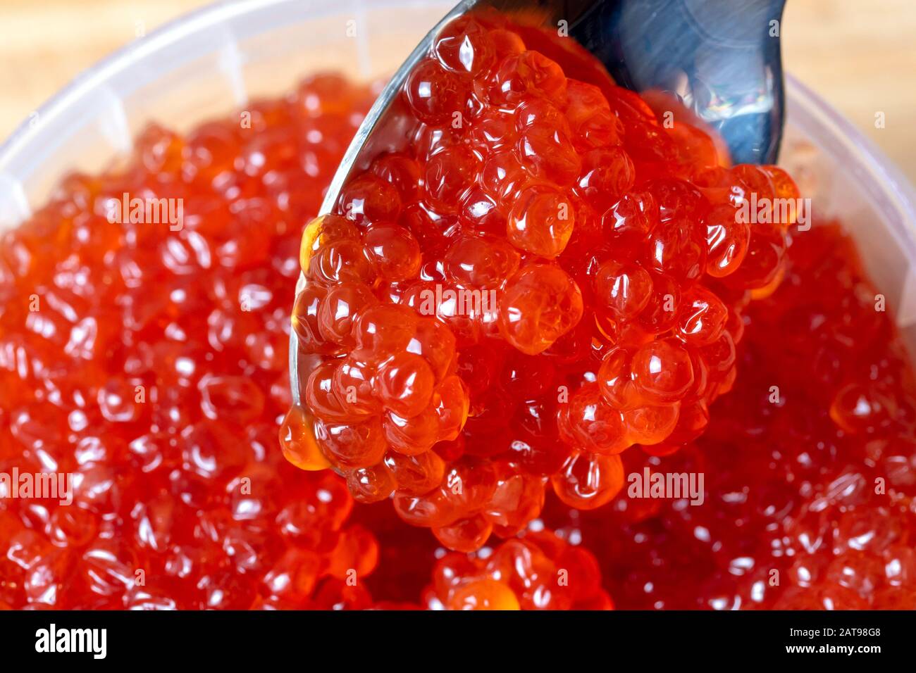 Red caviar in a metal spoon. luxury gourmet delicacy Stock Photo - Alamy