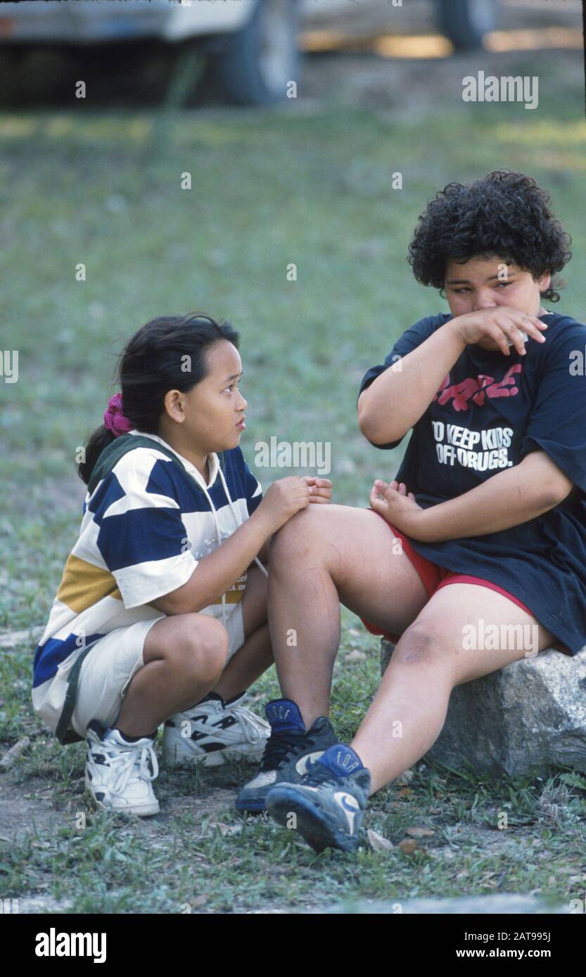 Fifth grade girl consoling sad friend at YMCA summer camp. ©Bob ...