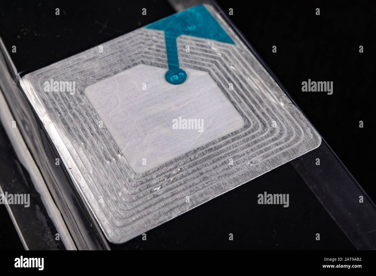 Sticky security chip to the packaging of the goods in the store. A ...