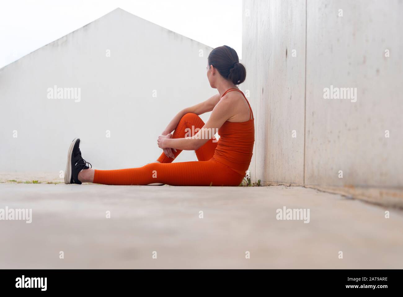 active woman resting after running and exercise Stock Photo - Alamy
