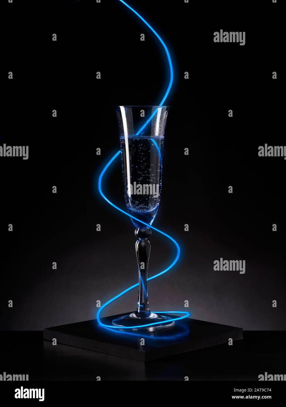 Champagne glass with blue swirl Stock Photo - Alamy