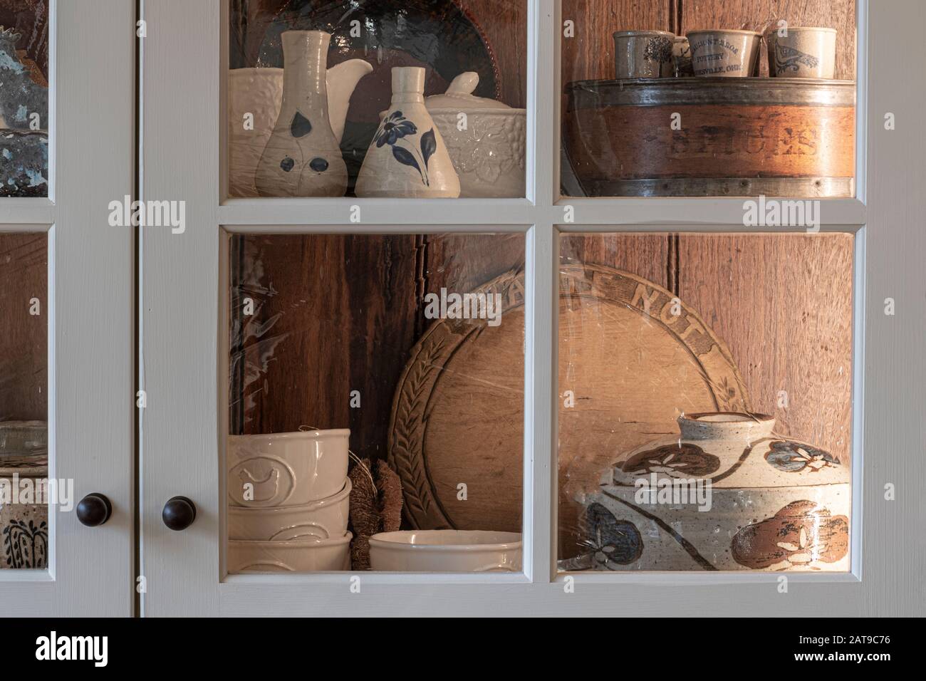 Dishes in Country Rural Cupboard Stock Photo - Alamy