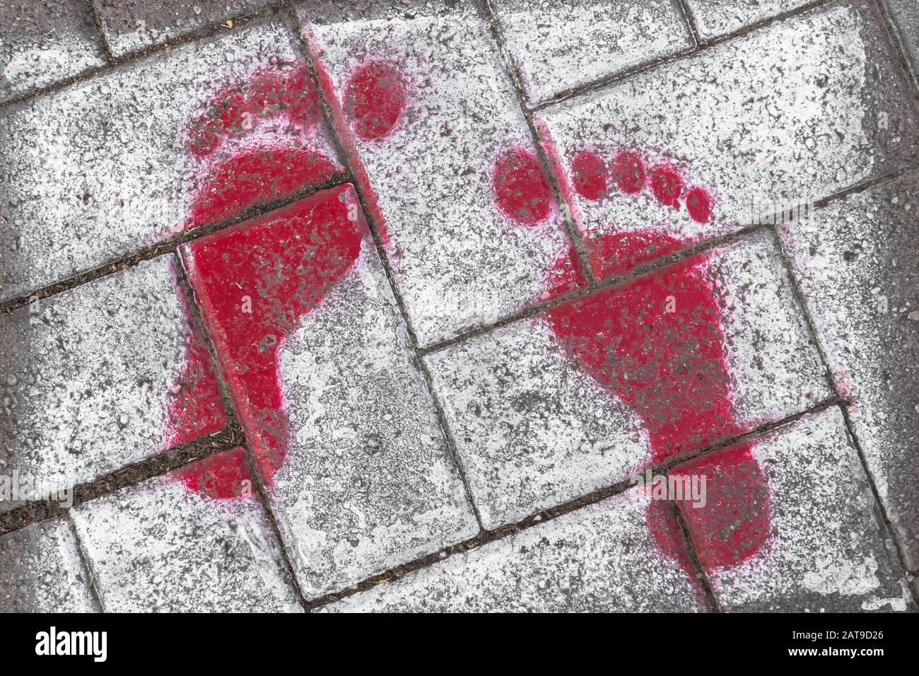 Painted red Foot print on Rustic Concrete Background. Ideal for ...