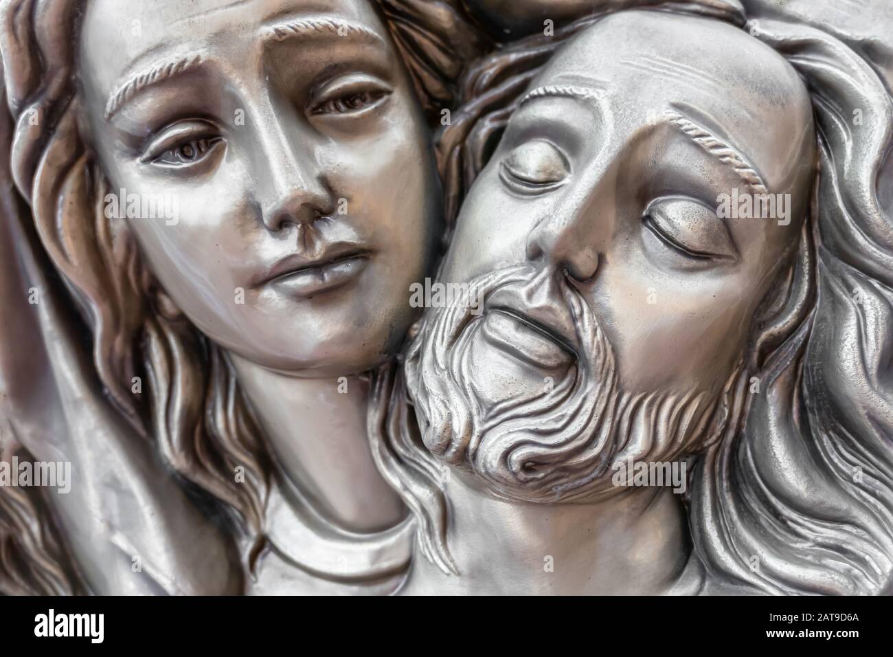 Bronze Statue of dead Jesus Christ down from the cross, being embraced ...