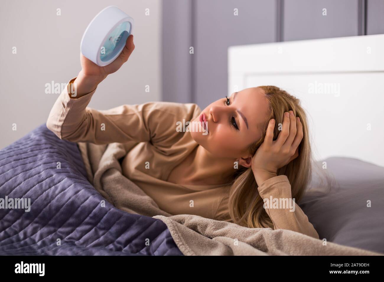 Woman waking up angry hi-res stock photography and images - Alamy