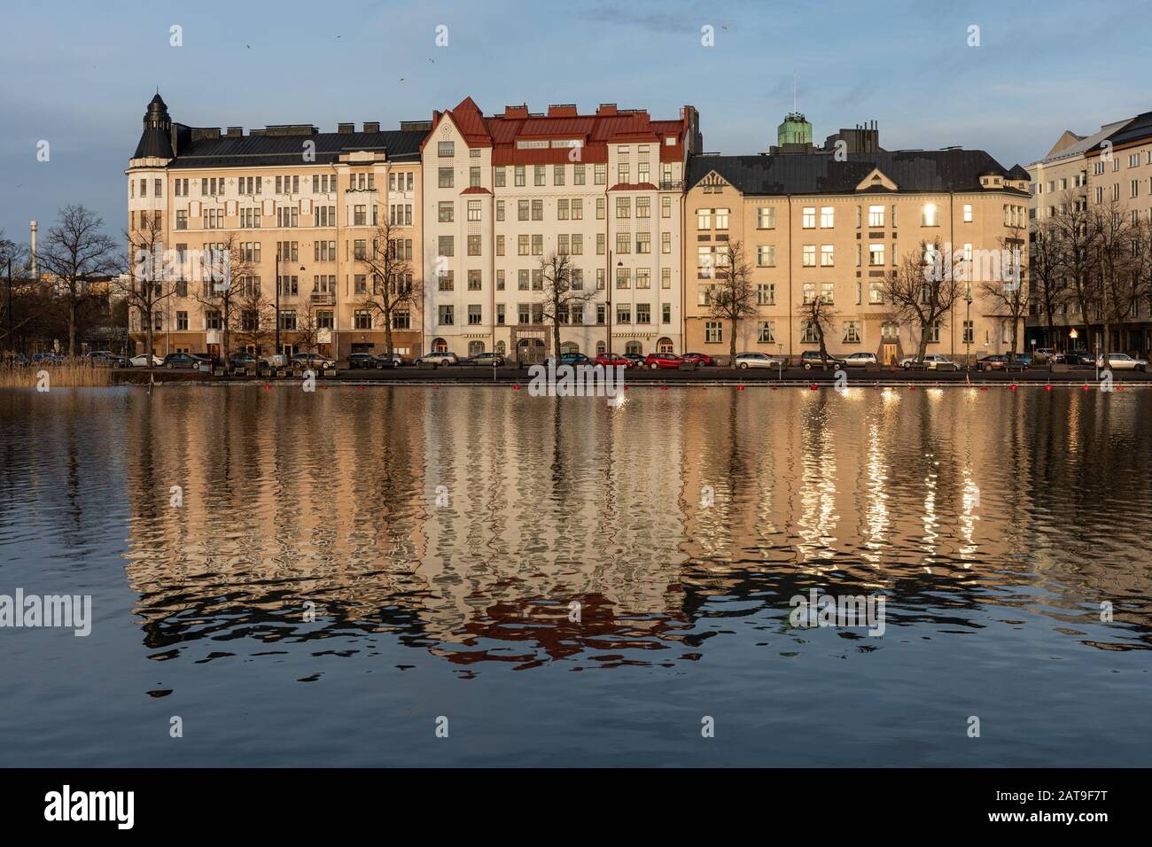 Buildings of Siltasaari residential district reflecting from Kaisaniemi ...