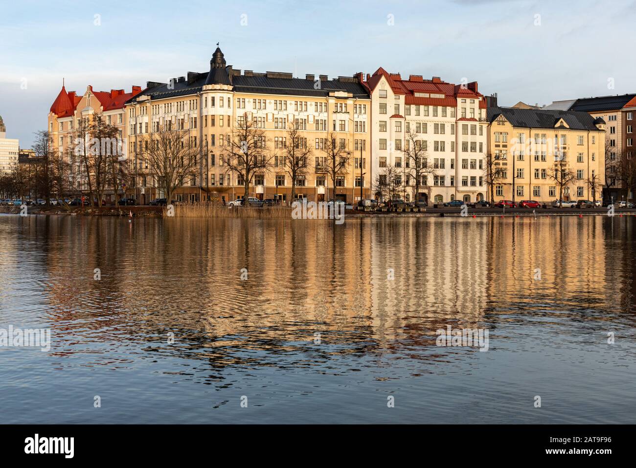 Residential buildings of Siltasaari district reflecting from Kaisaniemi ...