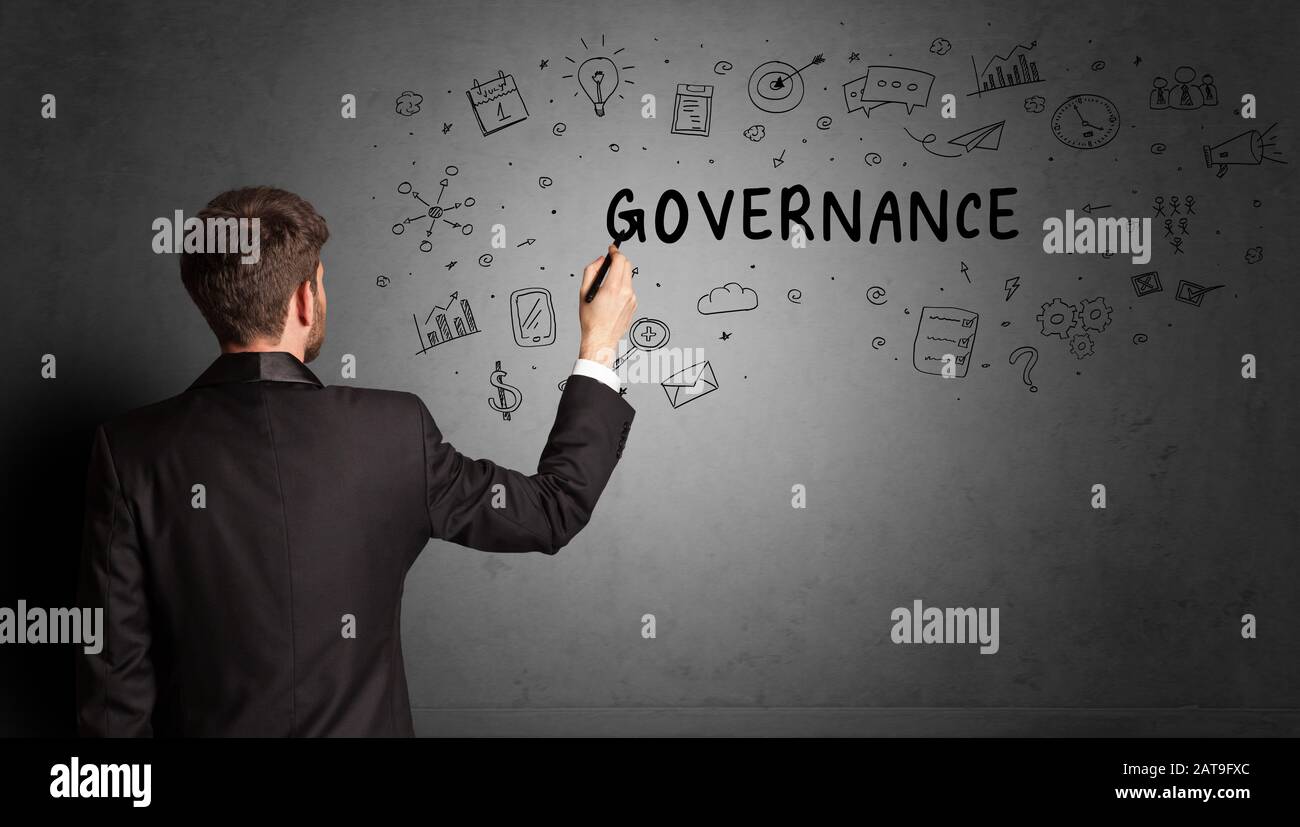 businessman drawing a creative idea sketch with GOVERNANCE inscription ...