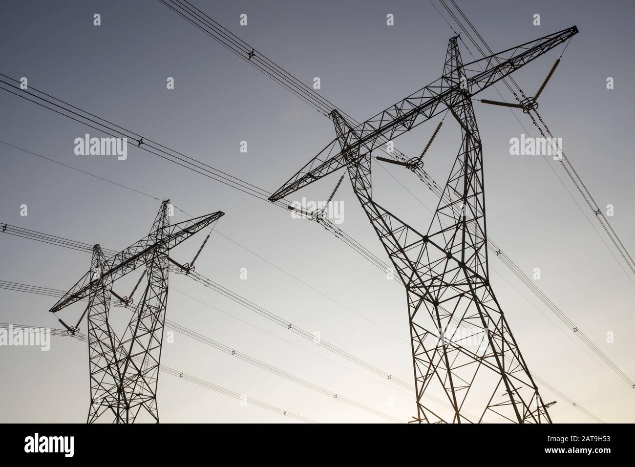 two Australian high voltage power lines at dusk Stock Photo - Alamy