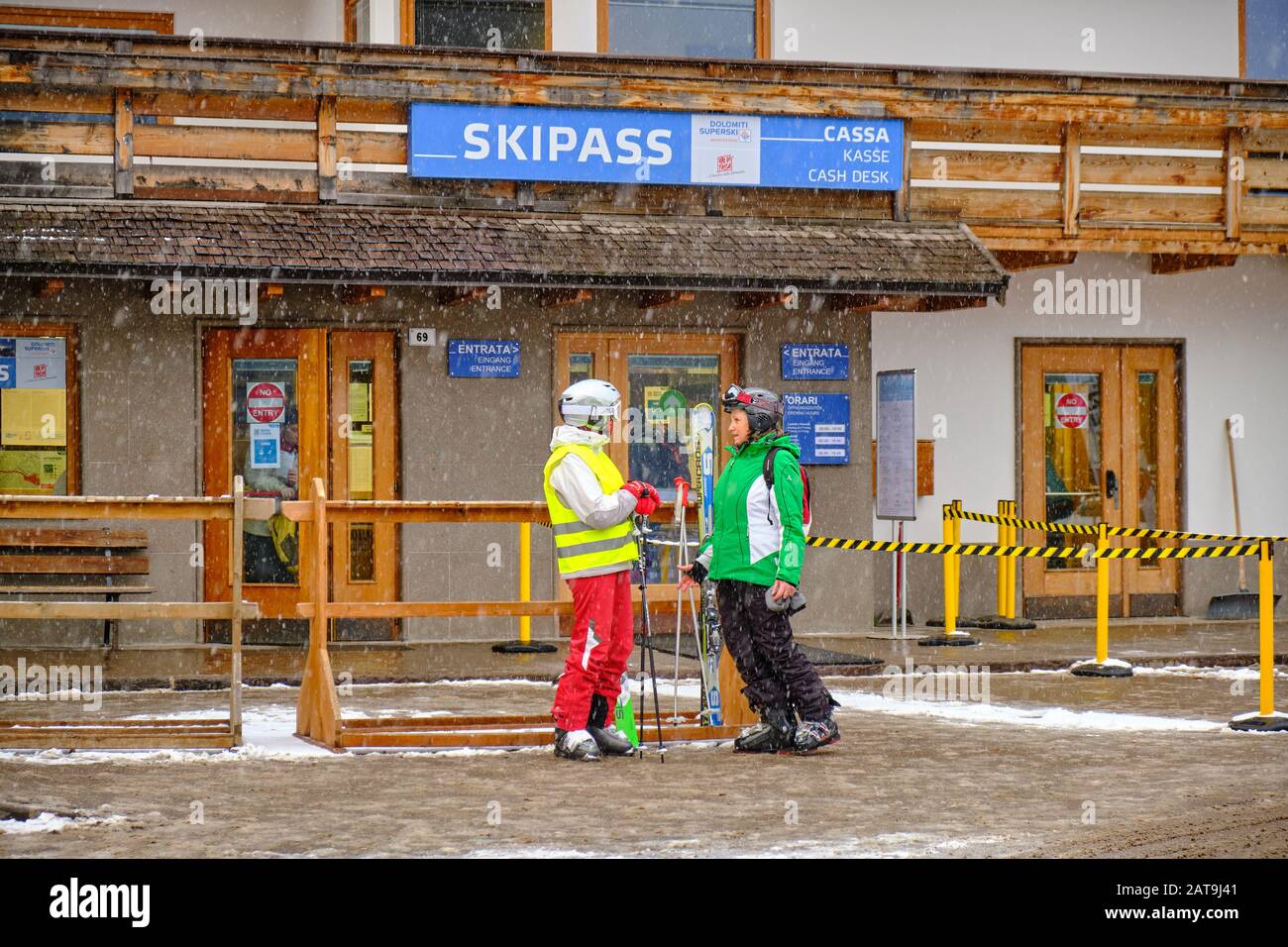 Canazei, Italy - January 18, 2020: Two people in front of the Skipass ...