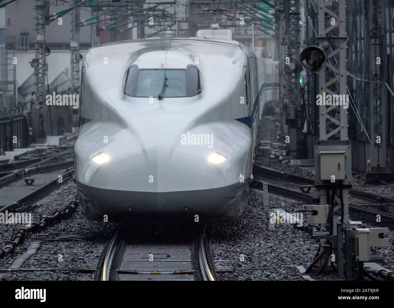 A JR N700 Series Shinkansen train approaching Tokyo Station Stock Photo ...