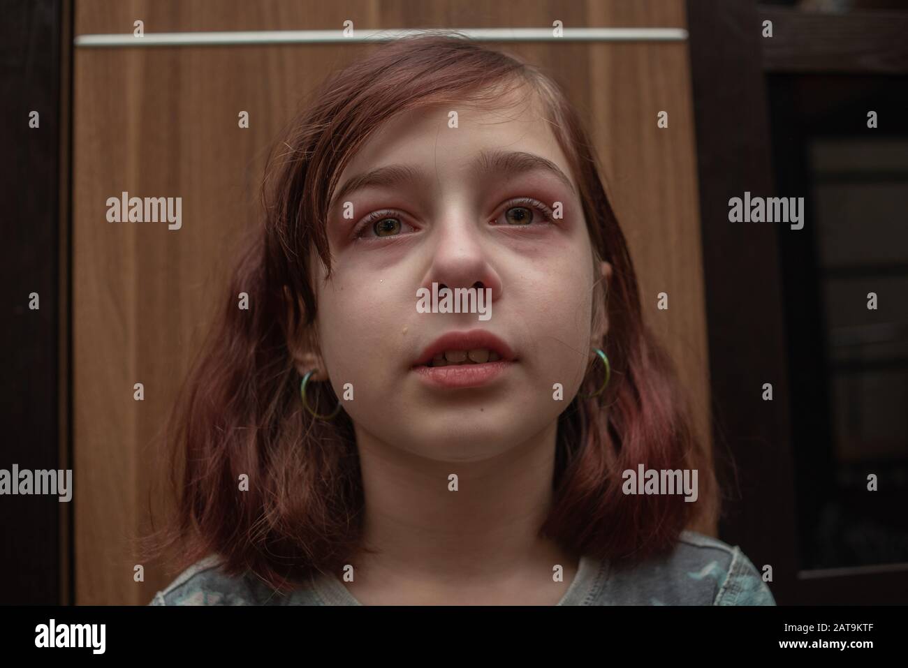 Portrait of little girl crying with tears rolling down her cheeks. Girl ...