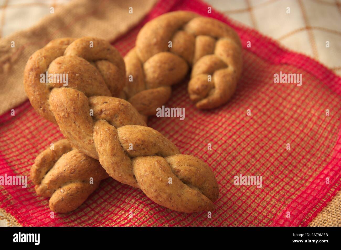 Typical sweet of three interlaced pasta meshes forming a braid ...