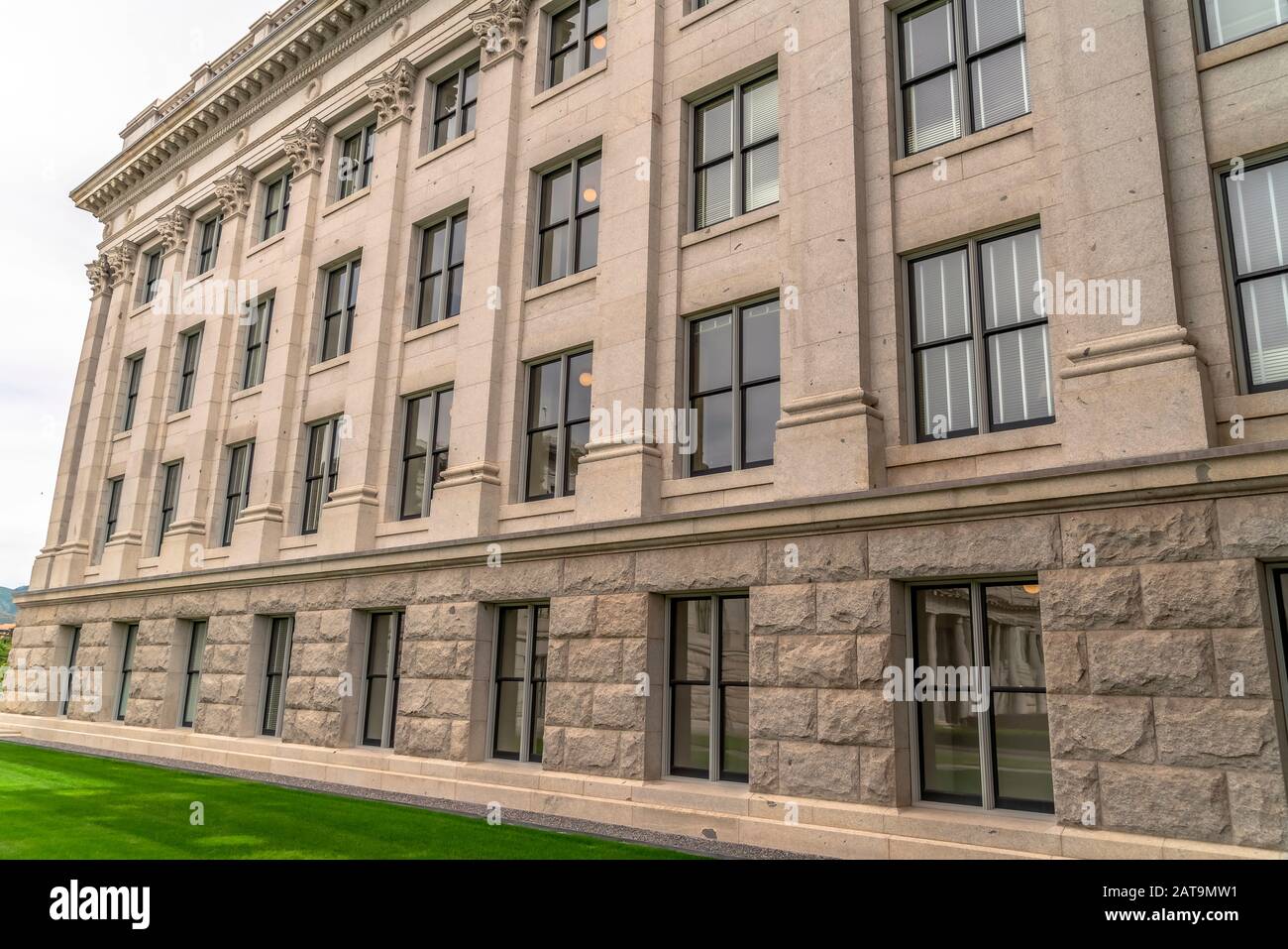 Building facade with decorative mouldings on the white stone exterior ...