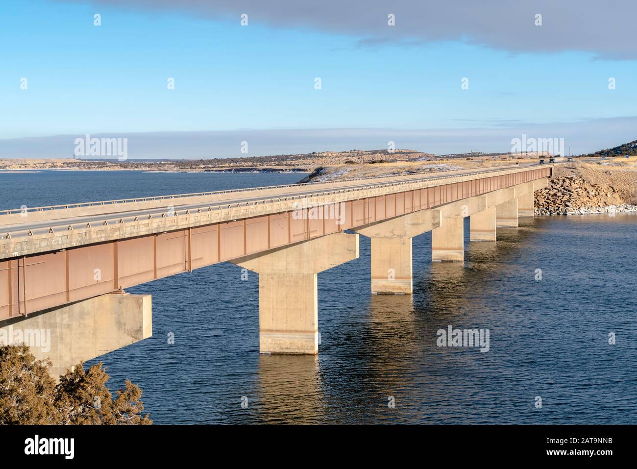 Beam bridge with deck supported by abutments or piers spanning over ...