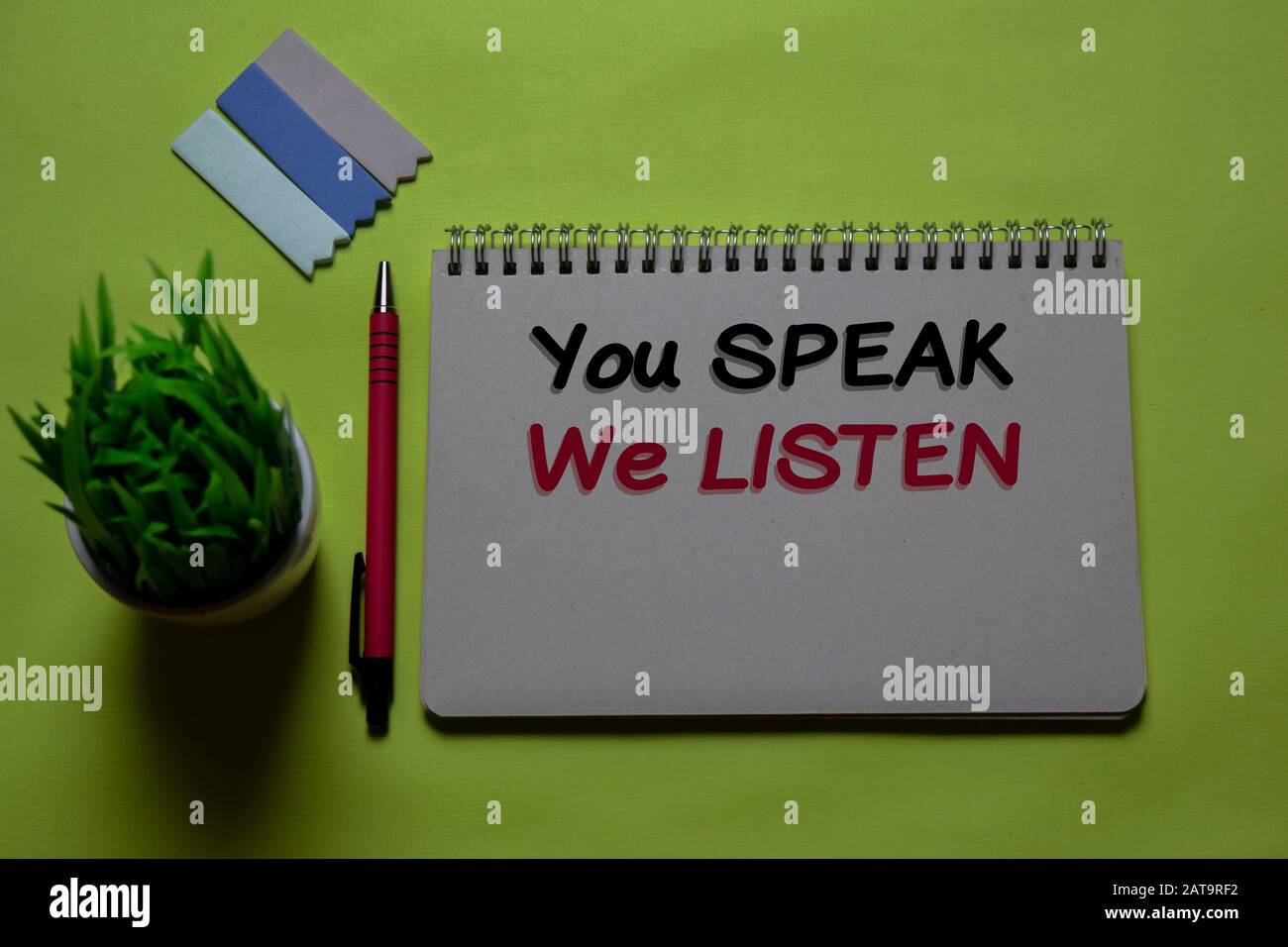 You Speak We Listen write on a book isolated on office desk Stock Photo ...