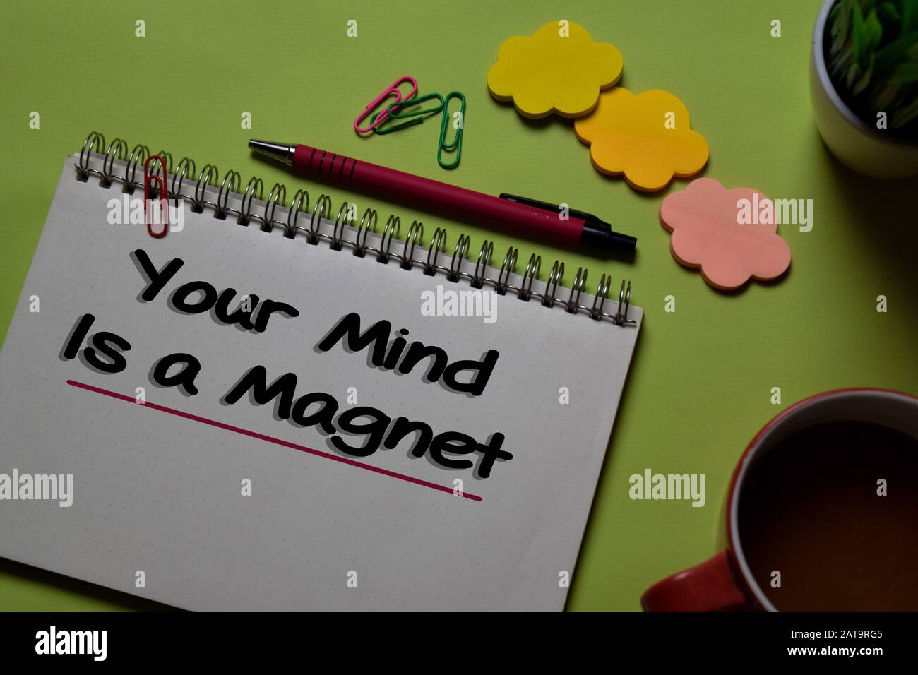 Your Mind Is a Magnet write on a book isolated on office desk Stock ...