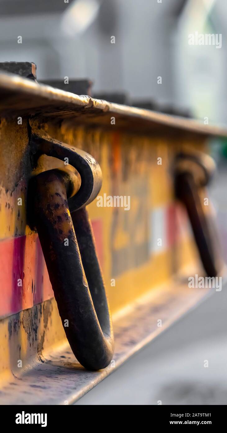 Vertical frame Platform with rusty metal rings on the side and raised ...