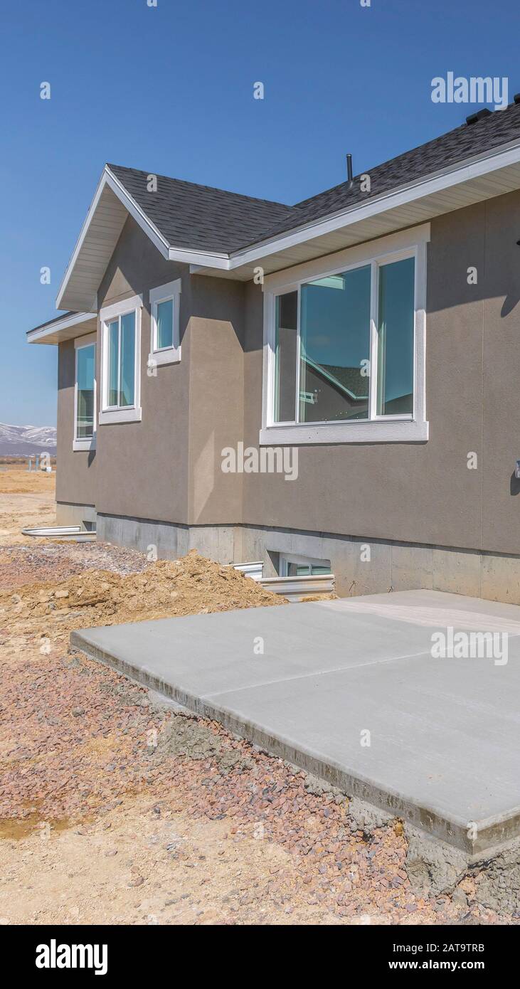 Vertical Construction outside a home with flat concrete surface ...