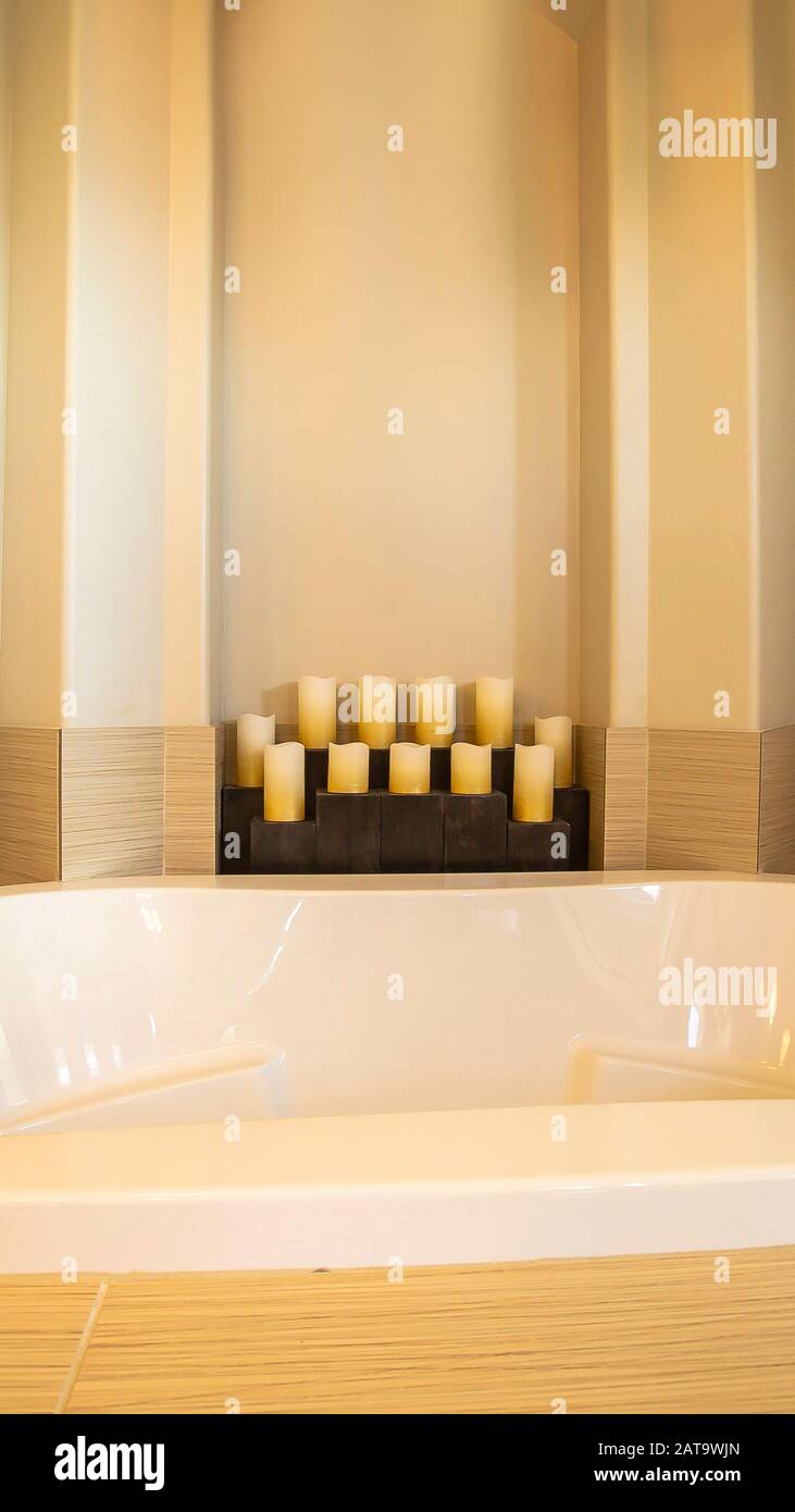 Vertical frame Clean glossy white built in bathtub with faucet inside ...