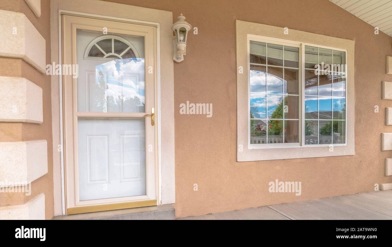 Panorama Front porch white front door with glass panes and windows at ...