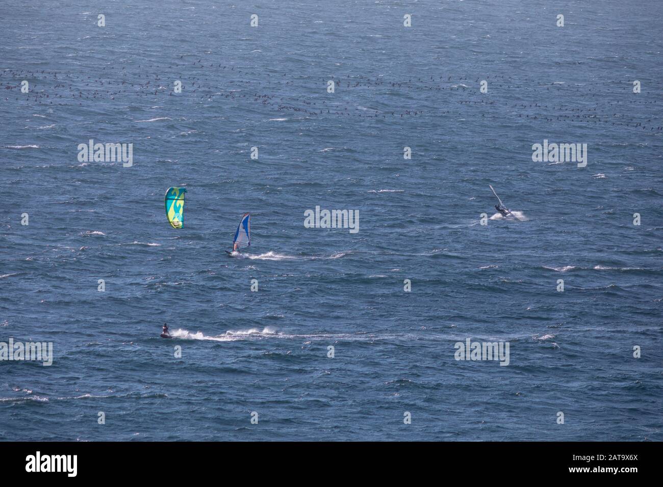 Windsurfing and kitesurfing face to face surfing at high speed in the ...