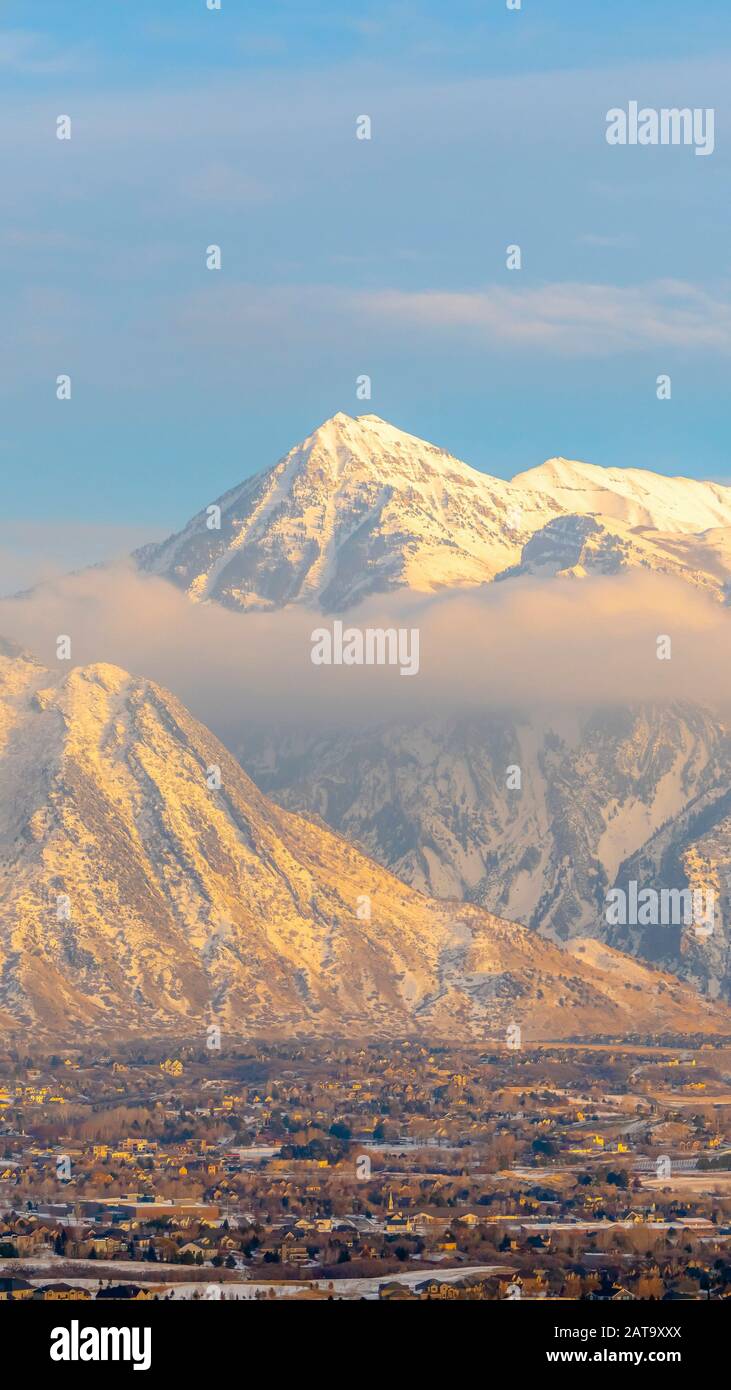 Vertical Stunning view of Mount Timpanogos with winter snow and golden ...