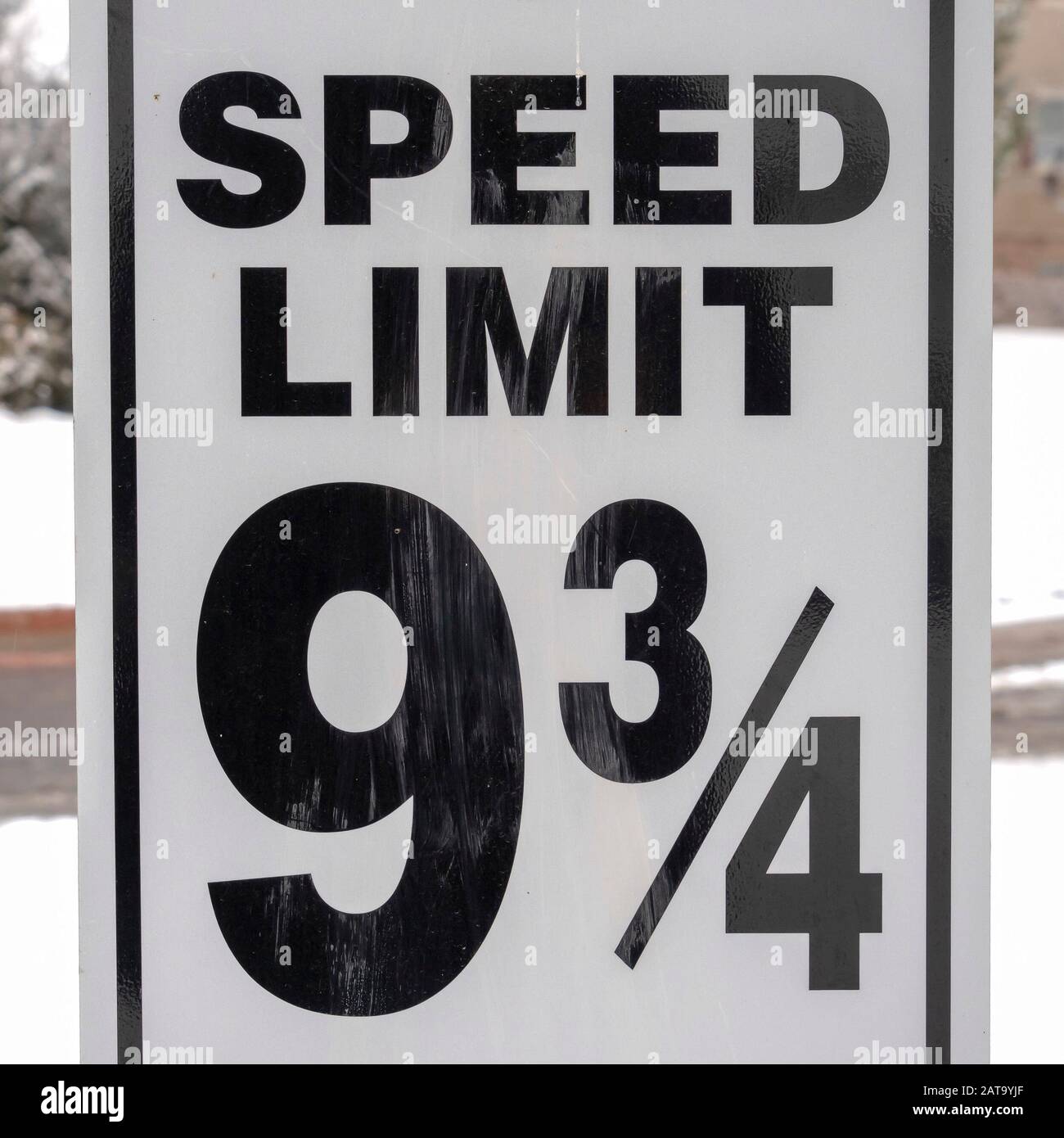 Photo Square Speed Limit sign with road and snow covered ground in the ...