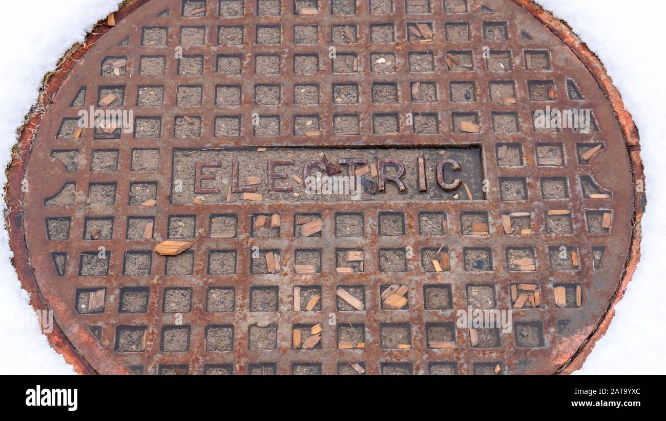 Photo Panorama frame Rusty circular utility electric manhole cover amid ...