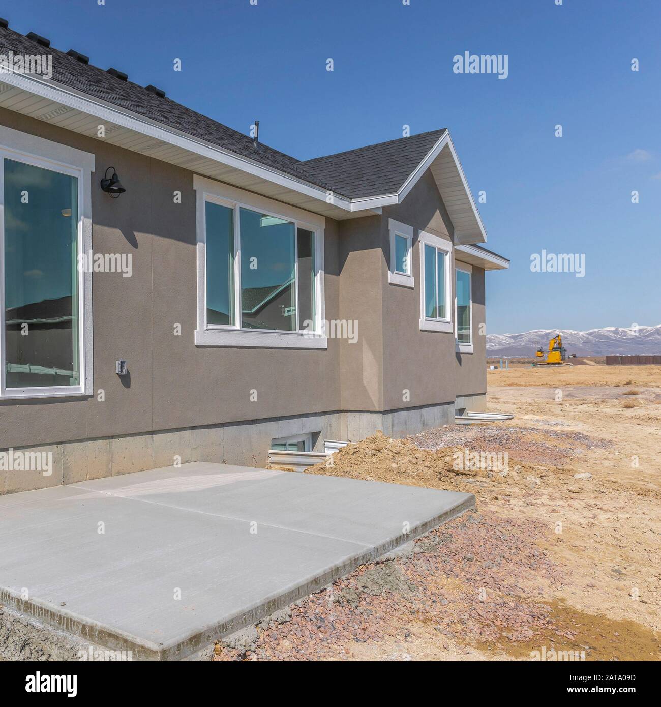 Square Construction outside a home with flat concrete surface ...
