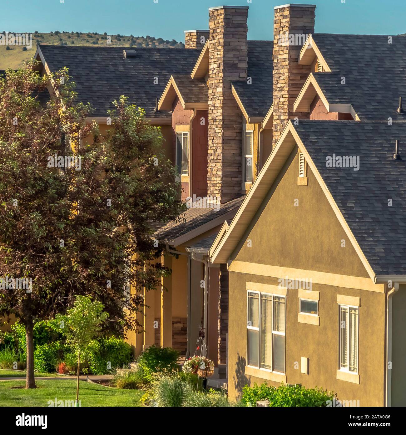 Square Residential scenery with pathways and grassy field in front of ...