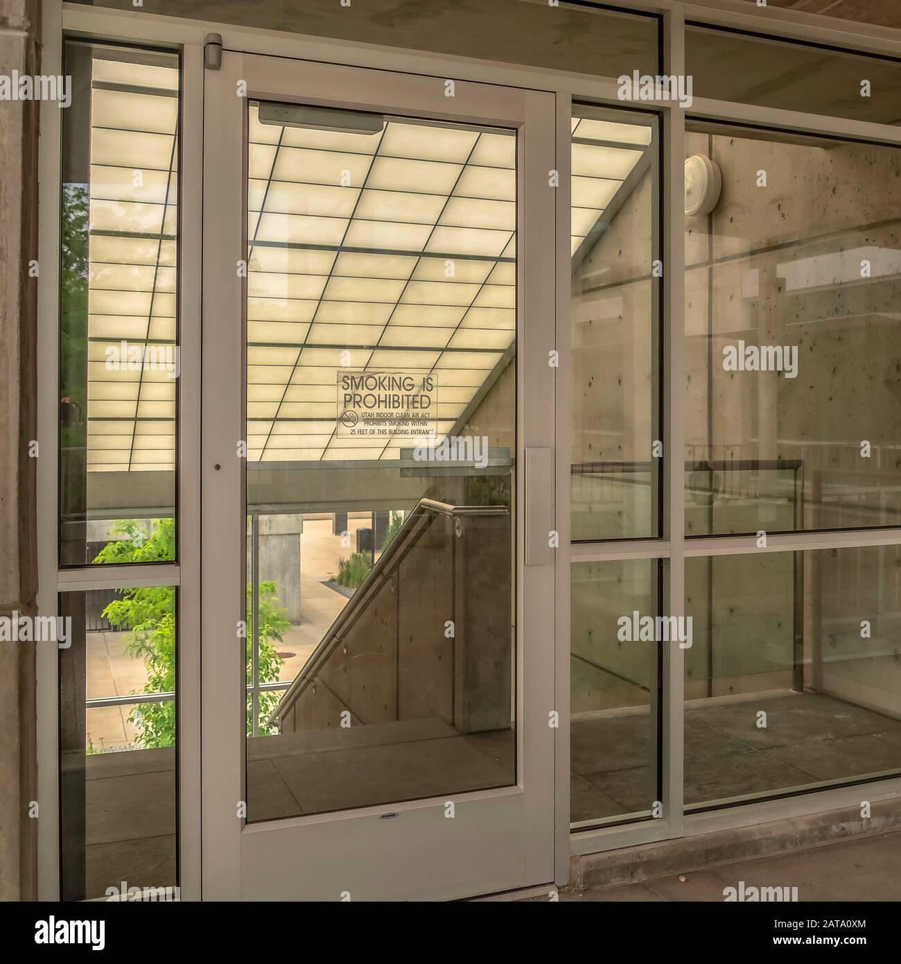 Square frame Glass door and wall at the balcony of building with stairs ...