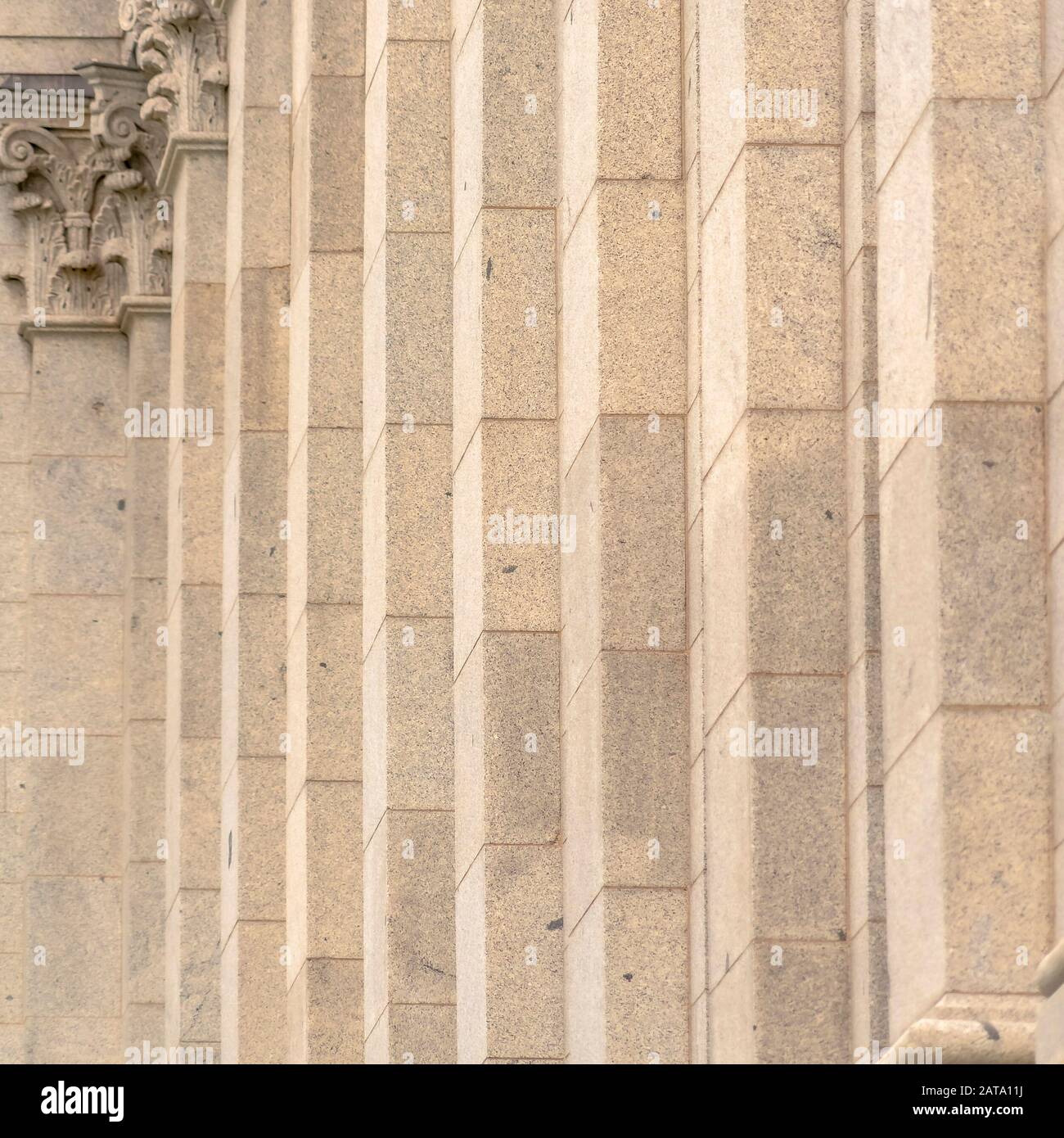 Square frame Beautiful building exterior with white stone wall and ...