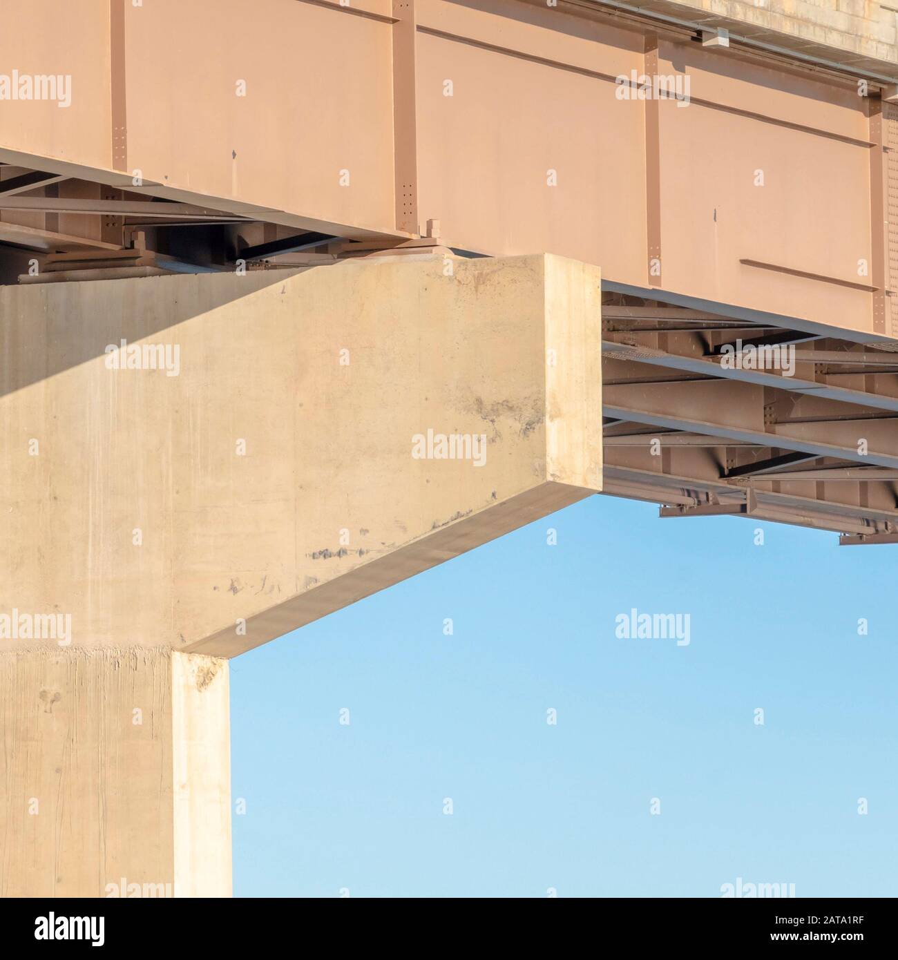 Square View beneath a stringer bridge with massive abutment that ...