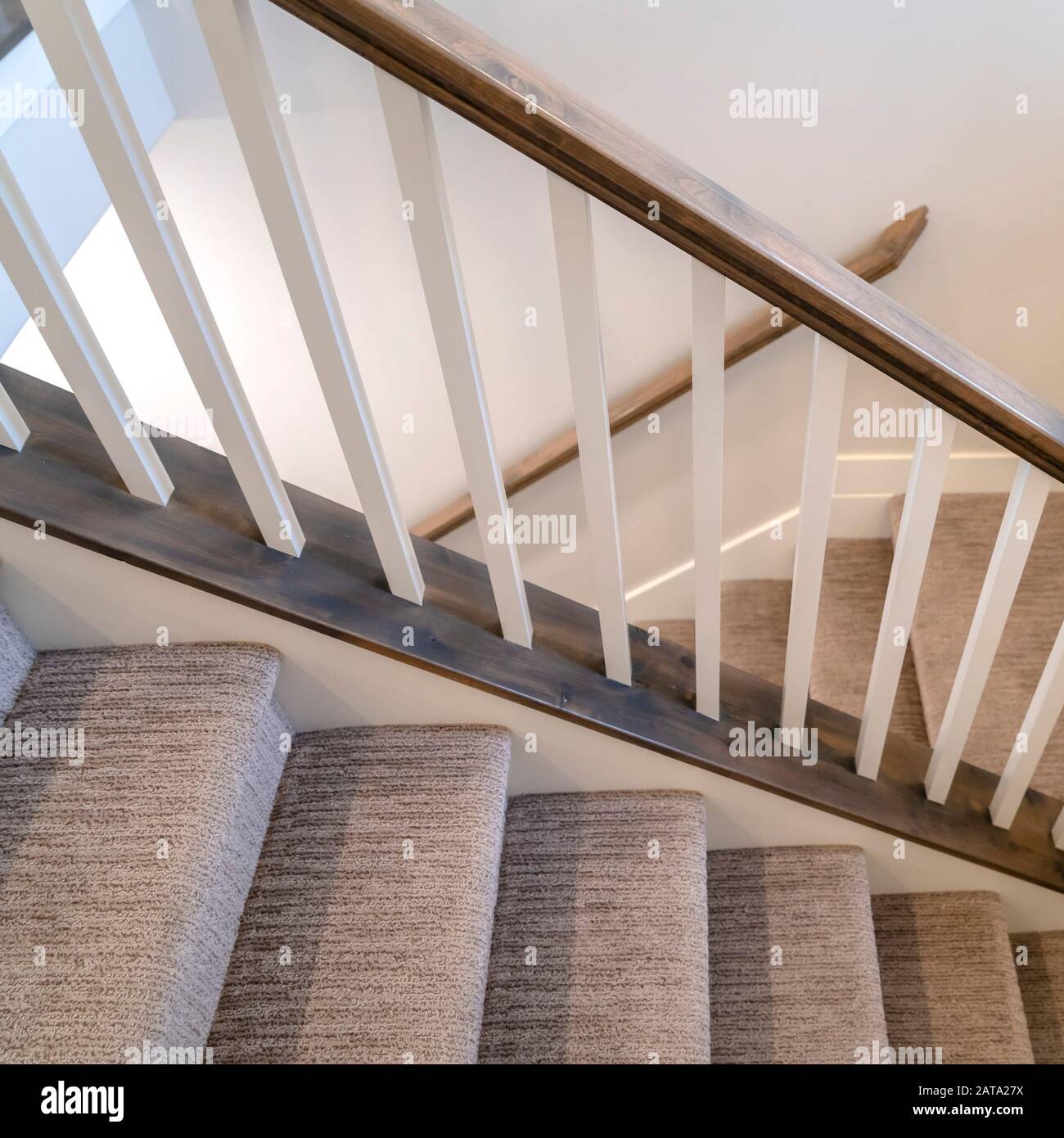 Photo Square frame U shaped indoor staircase of home with treads and ...
