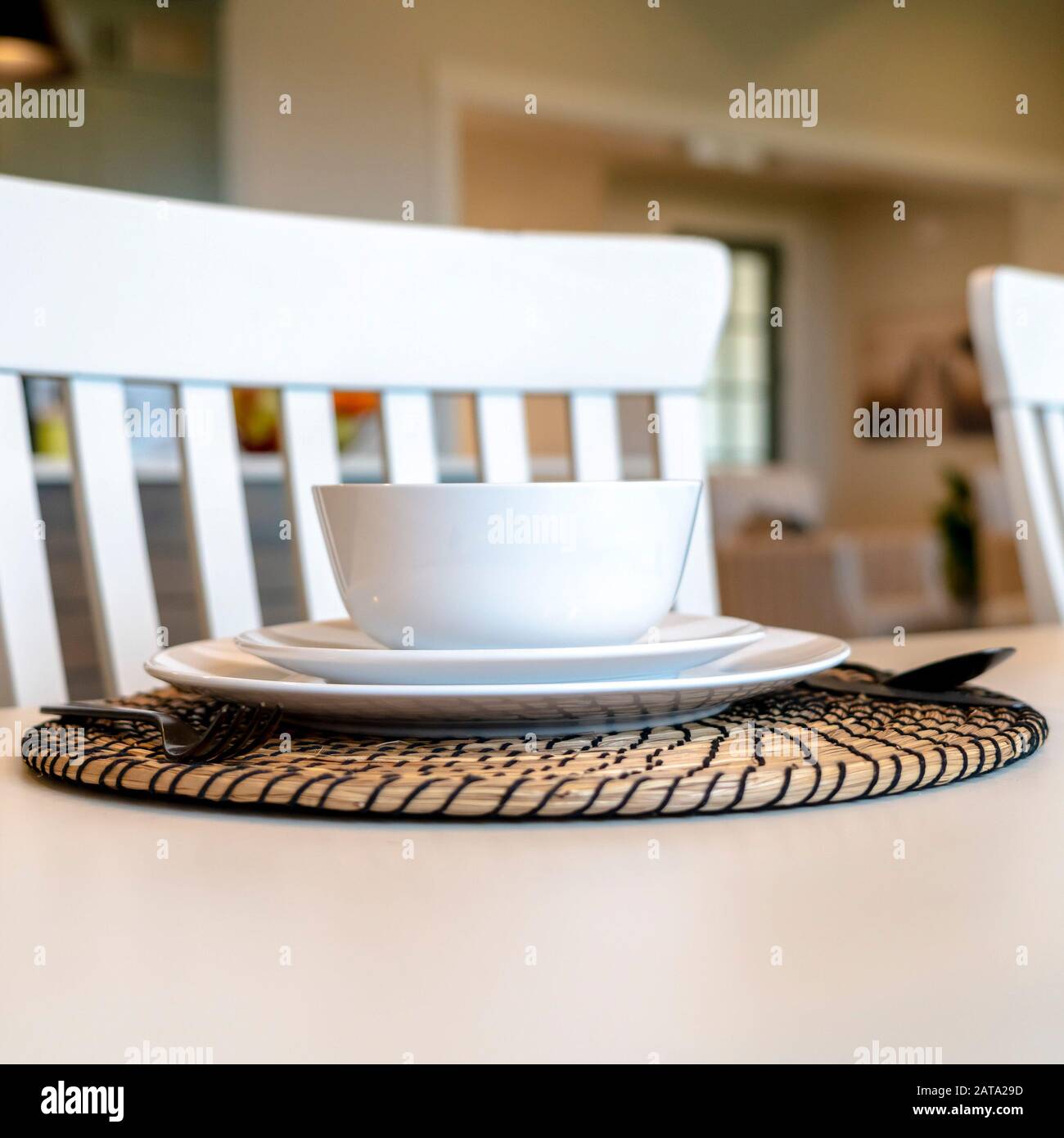 Photo Square Table setting on family dining table with white tableware ...