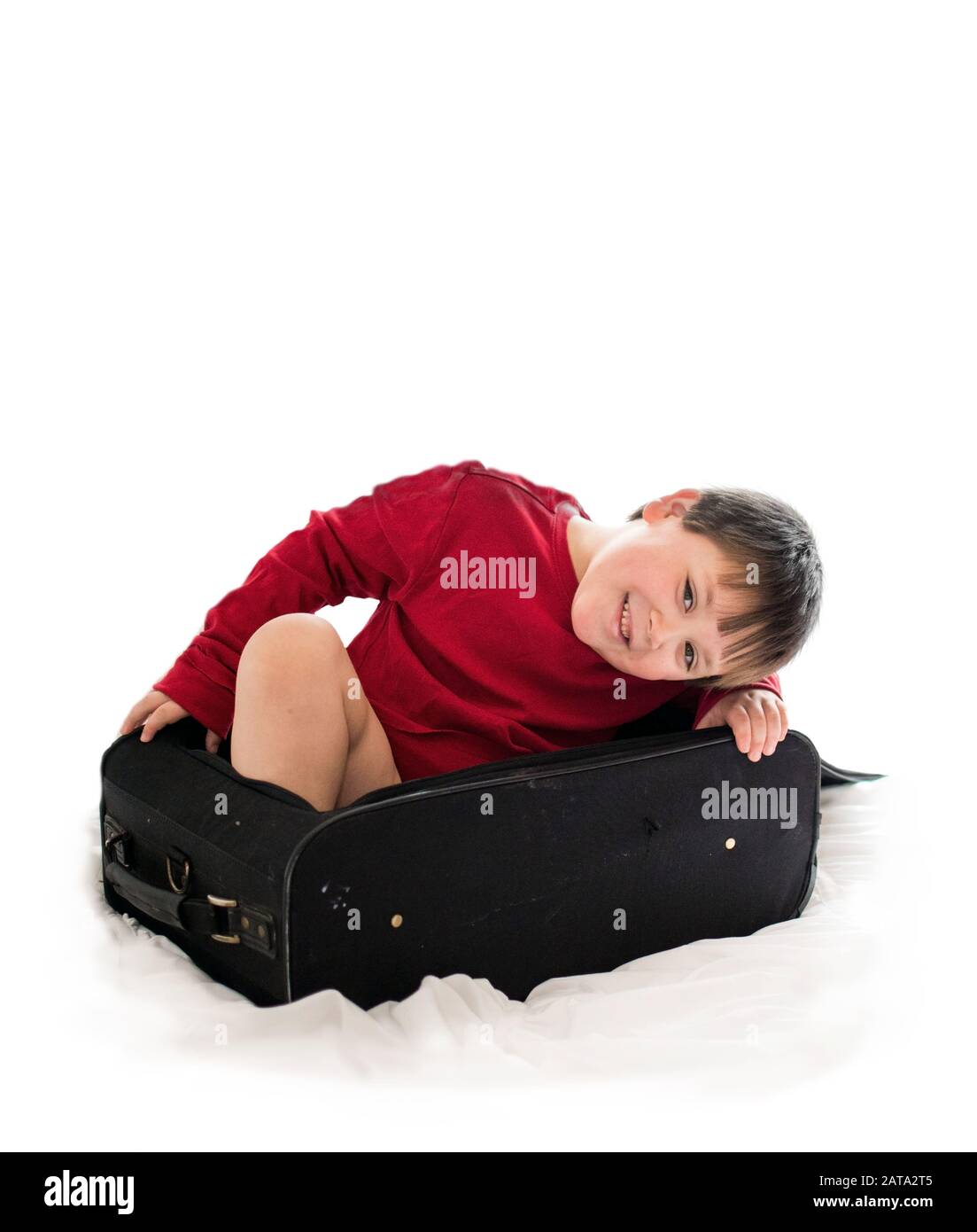 Boy packing suitcase hi-res stock photography and images - Alamy
