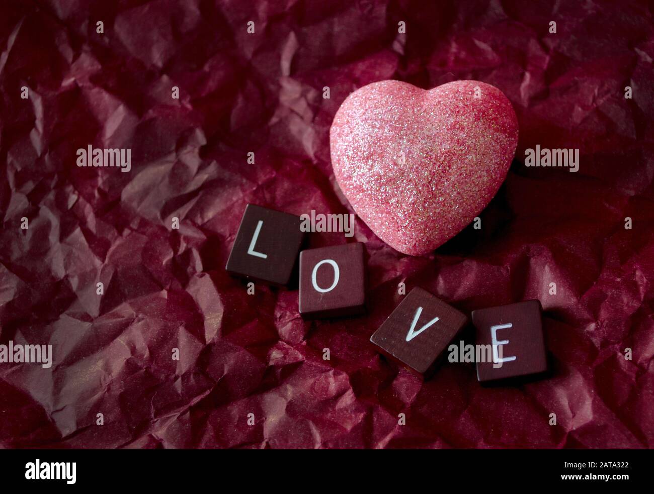 love tiles and heart on a deep red background with copy space Stock ...