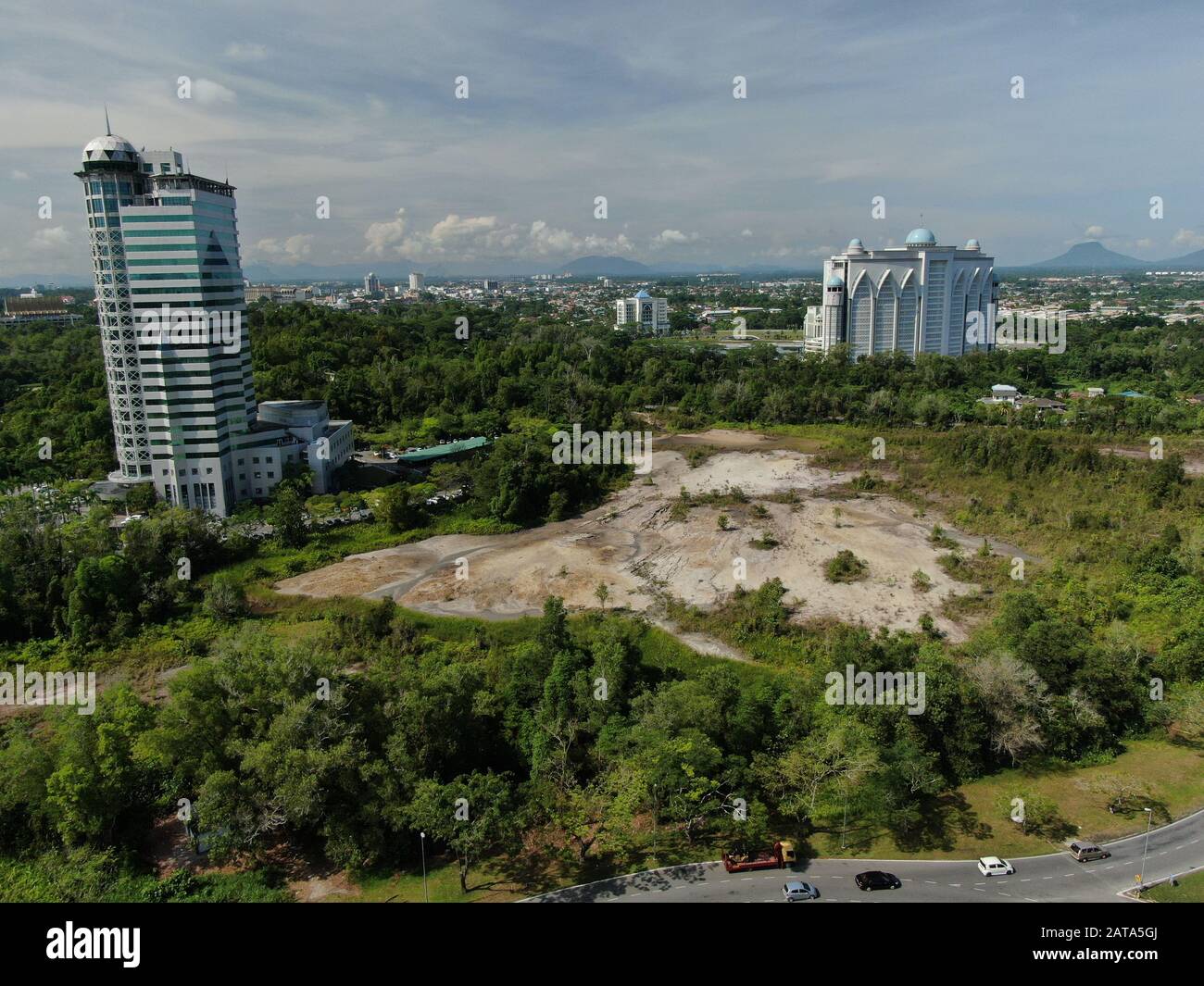 Aerial view of the Kuching city area, with the rivers, bridges, hills ...