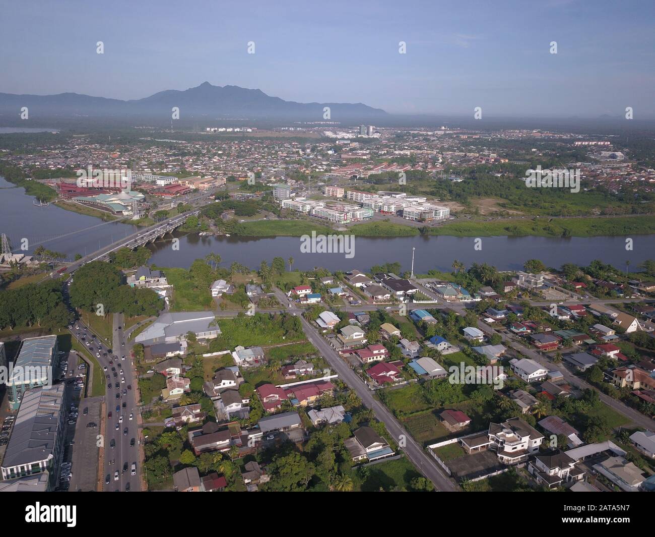Aerial view of the Kuching city area, with the rivers, bridges, hills ...