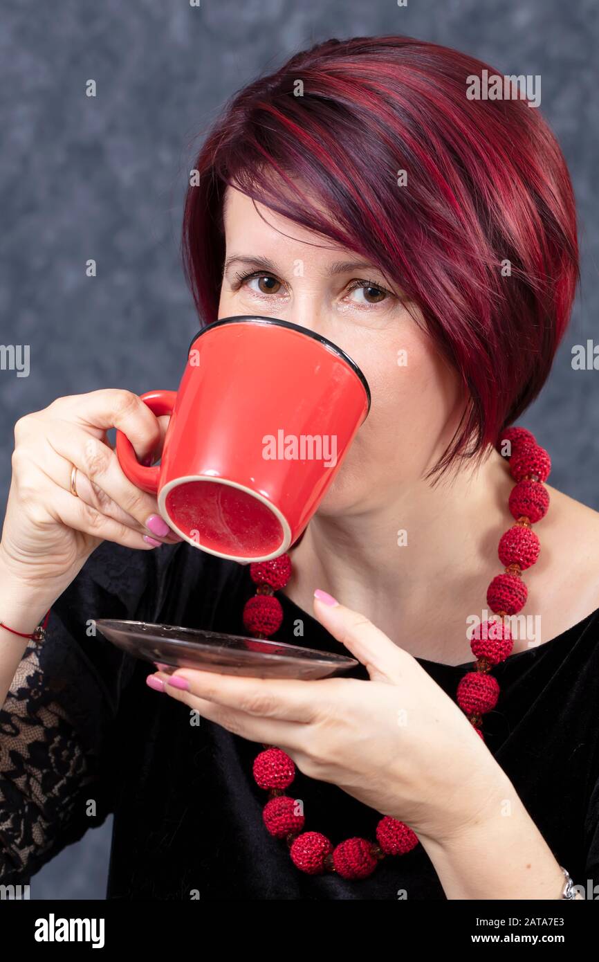 Female model drinking from coffee hi-res stock photography and images ...