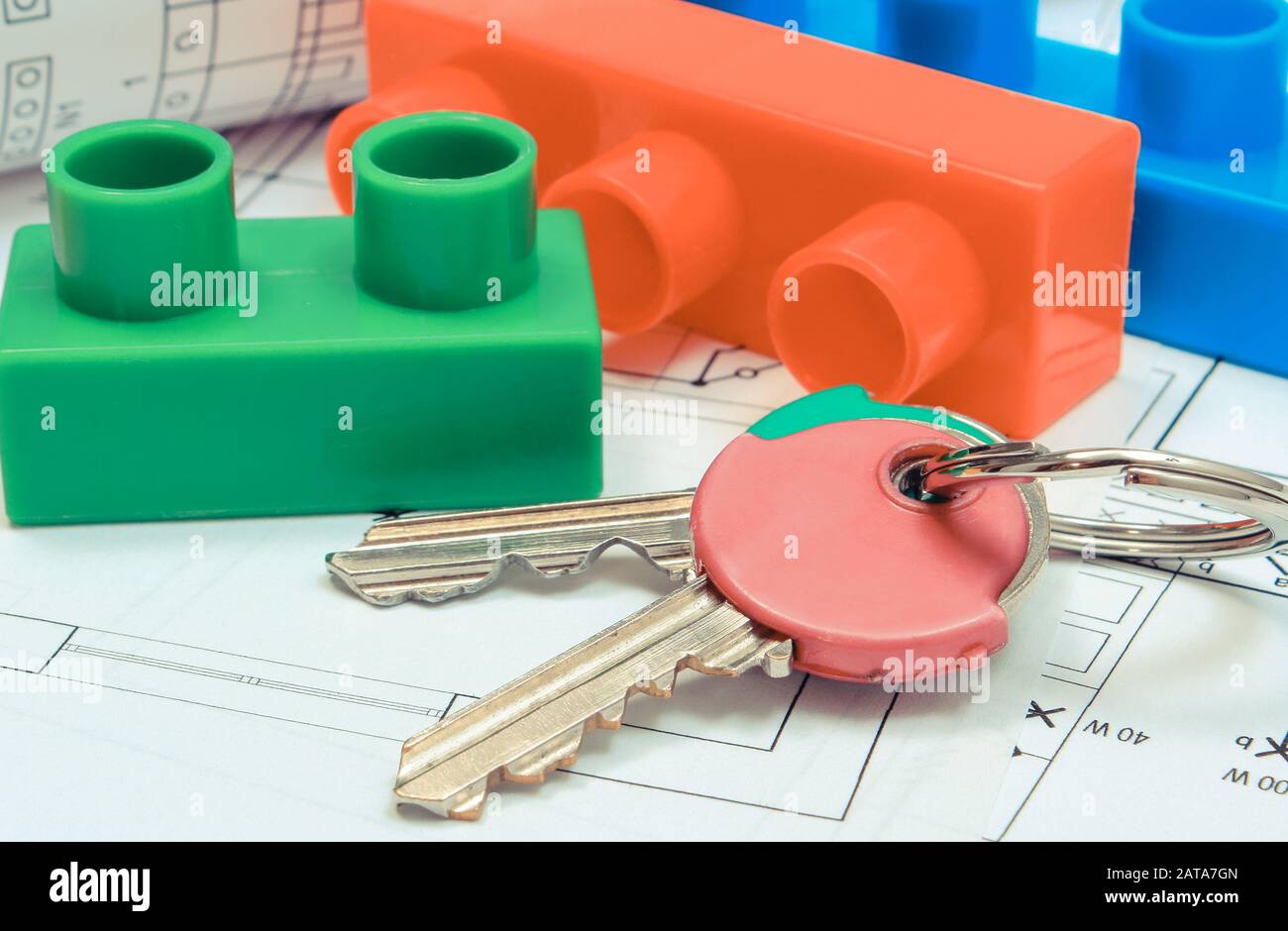 Home keys and colorful building blocks on electrical construction ...