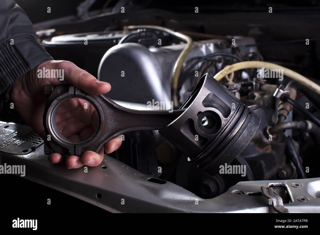 Car engine maintenance. Engine piston system repair. Hands with a ...