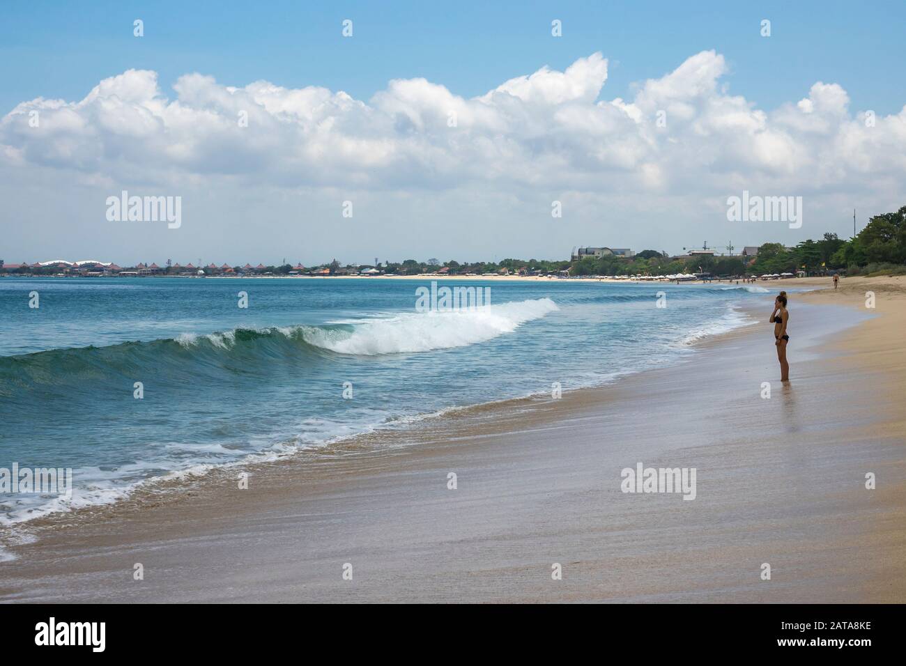 Young woman in bikini on the beach at Jimbaran Bay, Bali, Indonesia ...