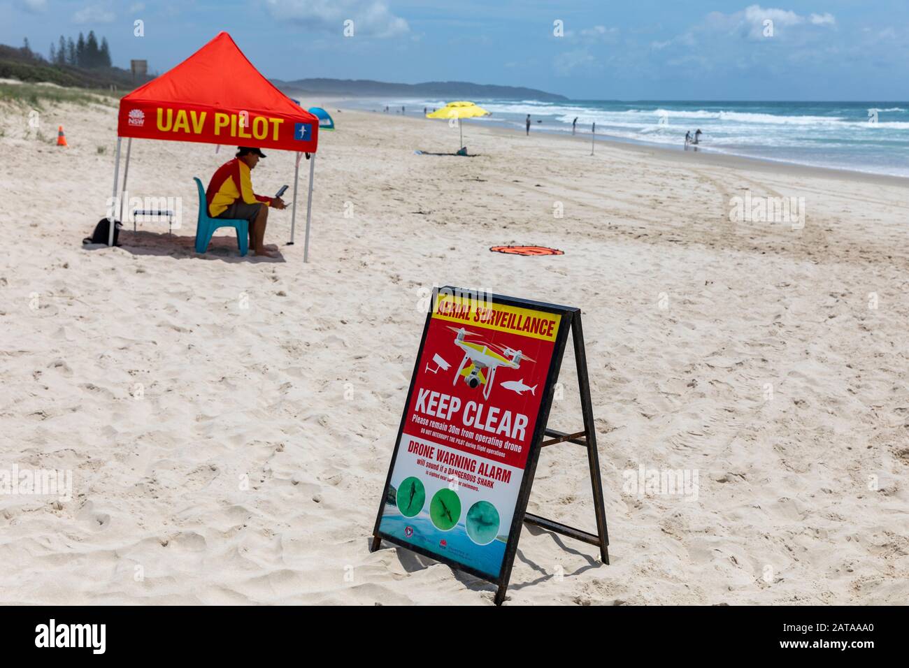UAV lifeguard pilot flying drone on seven mile beach to keep a lookout ...