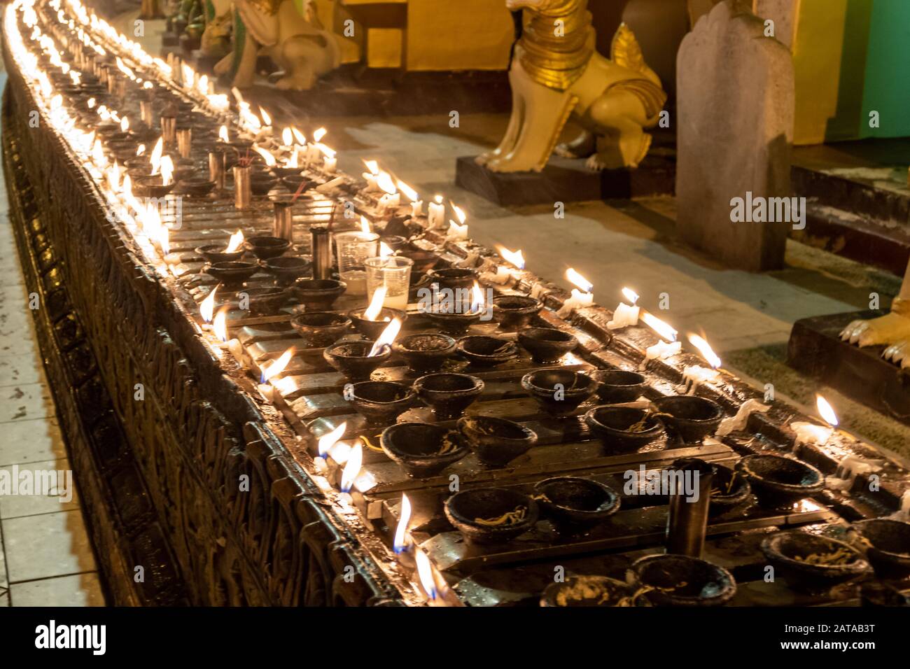 Candles at Shwedagon pagoda in Yangon, Myanmar Stock Photo - Alamy