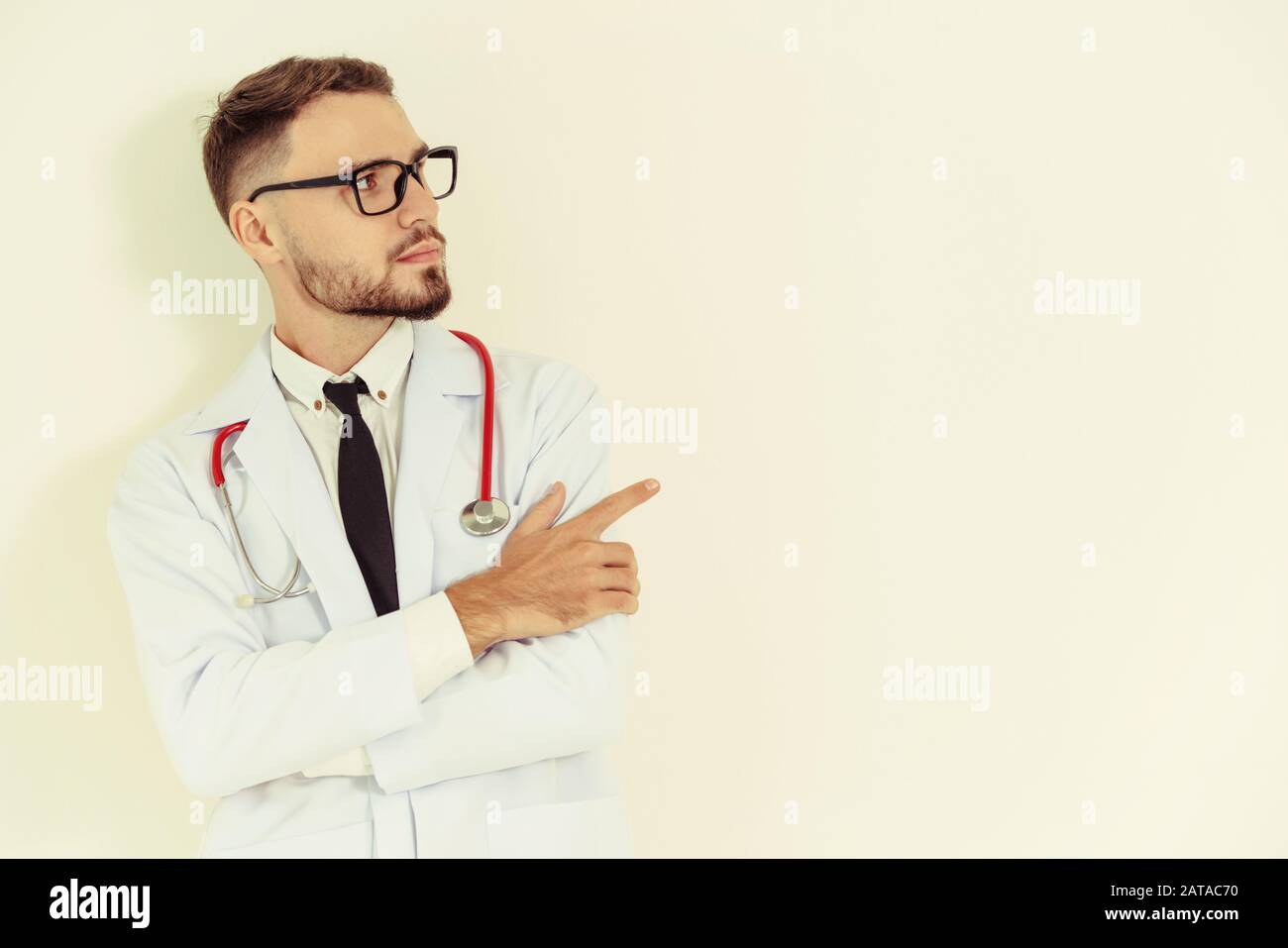 Male doctor pointing finger at blank space on white background. Medical ...