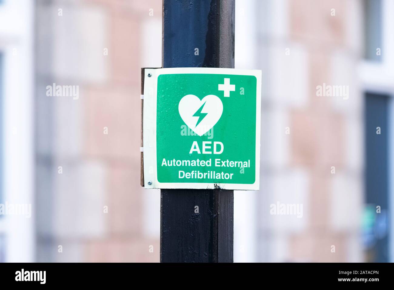 Defibrillator external automated AED sign in UK public street Stock ...