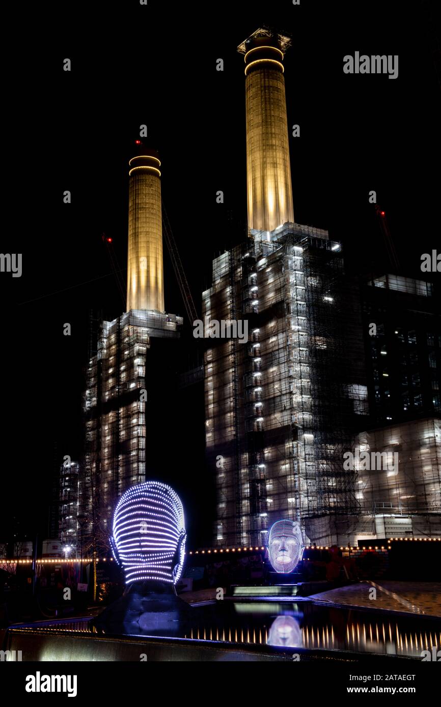 A view of two heads made up of lights entitled 'Talking Heads' by ...