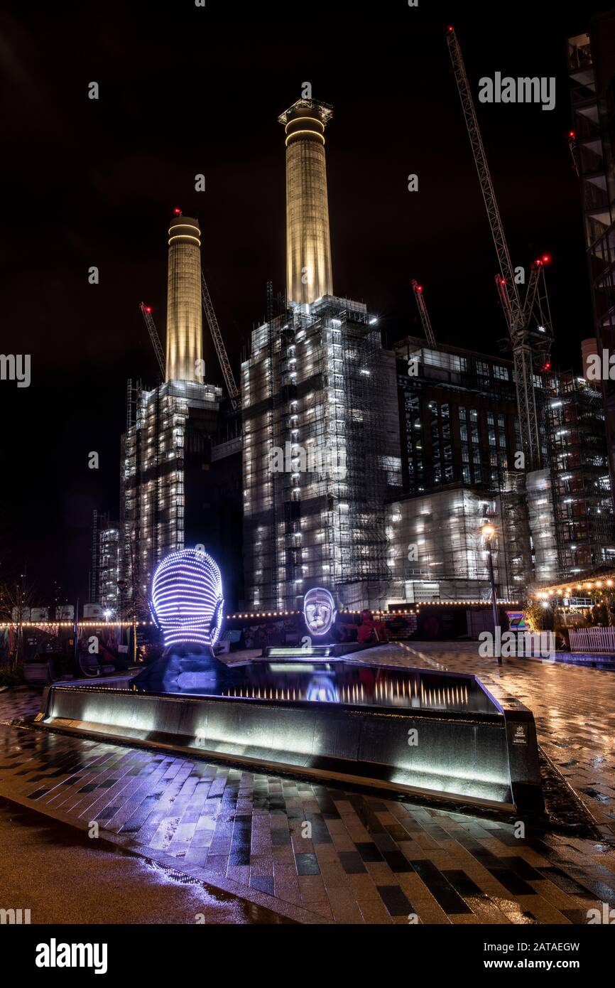 A view of two heads made up of lights entitled 'Talking Heads' by ...